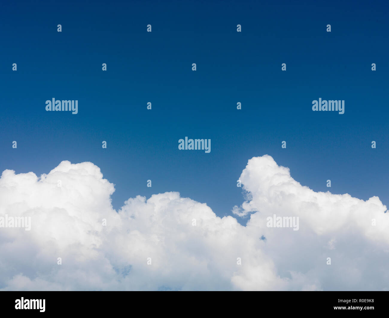 Cumulus clouds background texture Stock Photo - Alamy