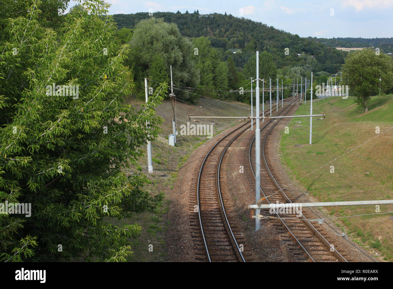 Empty tramway rail tracks with green trees around in Hokkaido, Japan ...