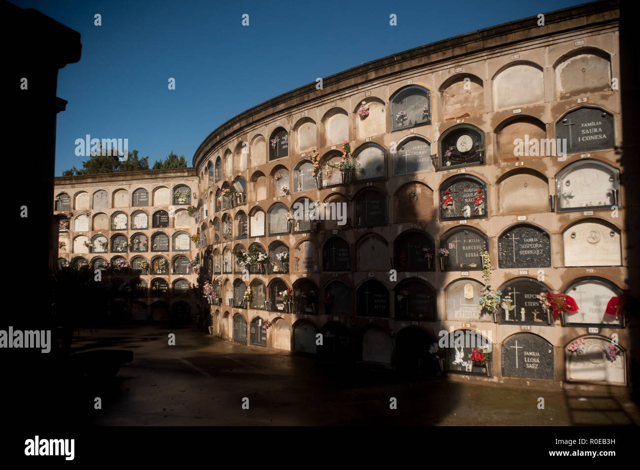Flowers decorate graves at Poblenou cemetery in Barcelona, Catalonia ...