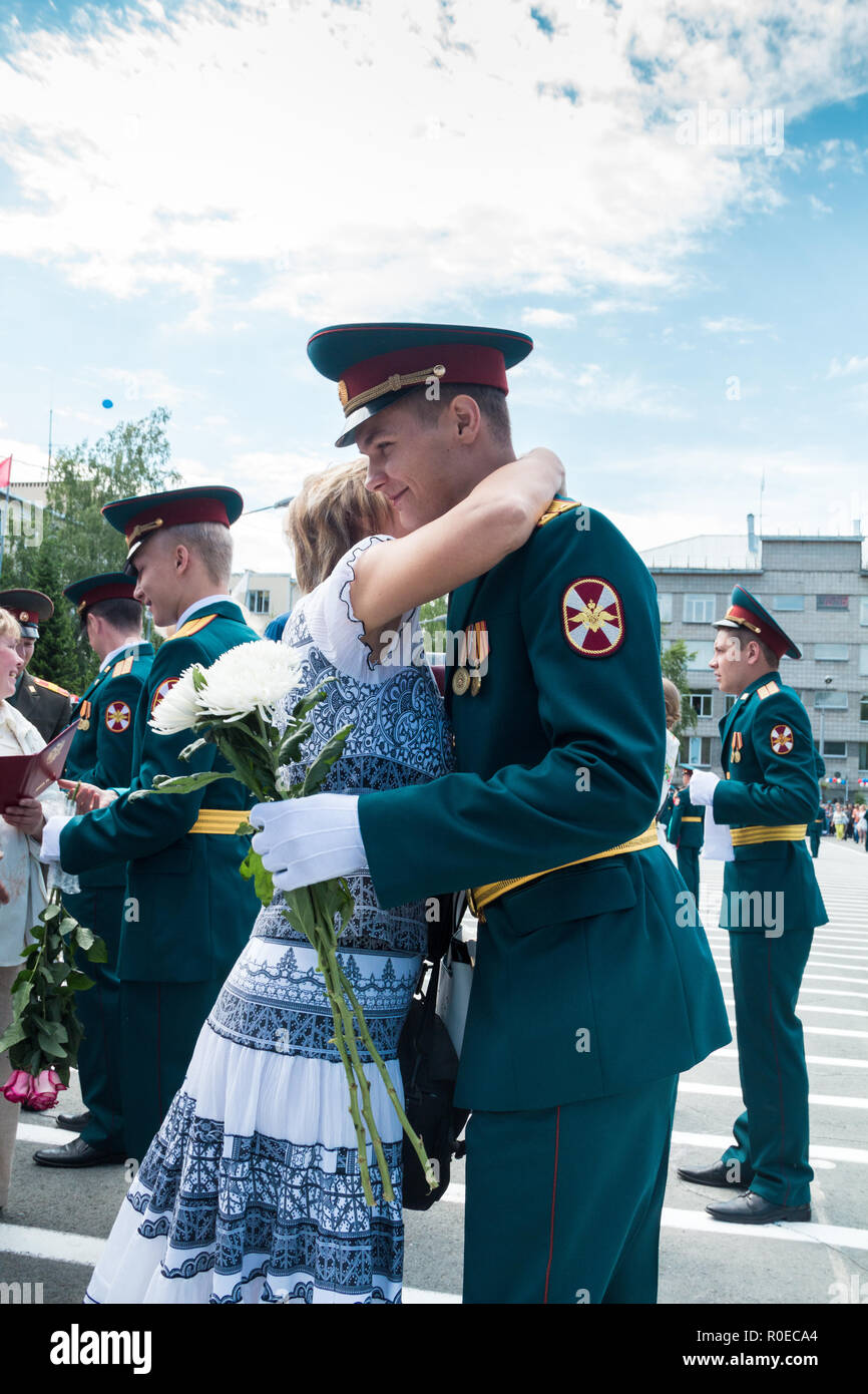 Russia, Novosibirsk -1 July 2016: Mom congratulates son on graduation ...