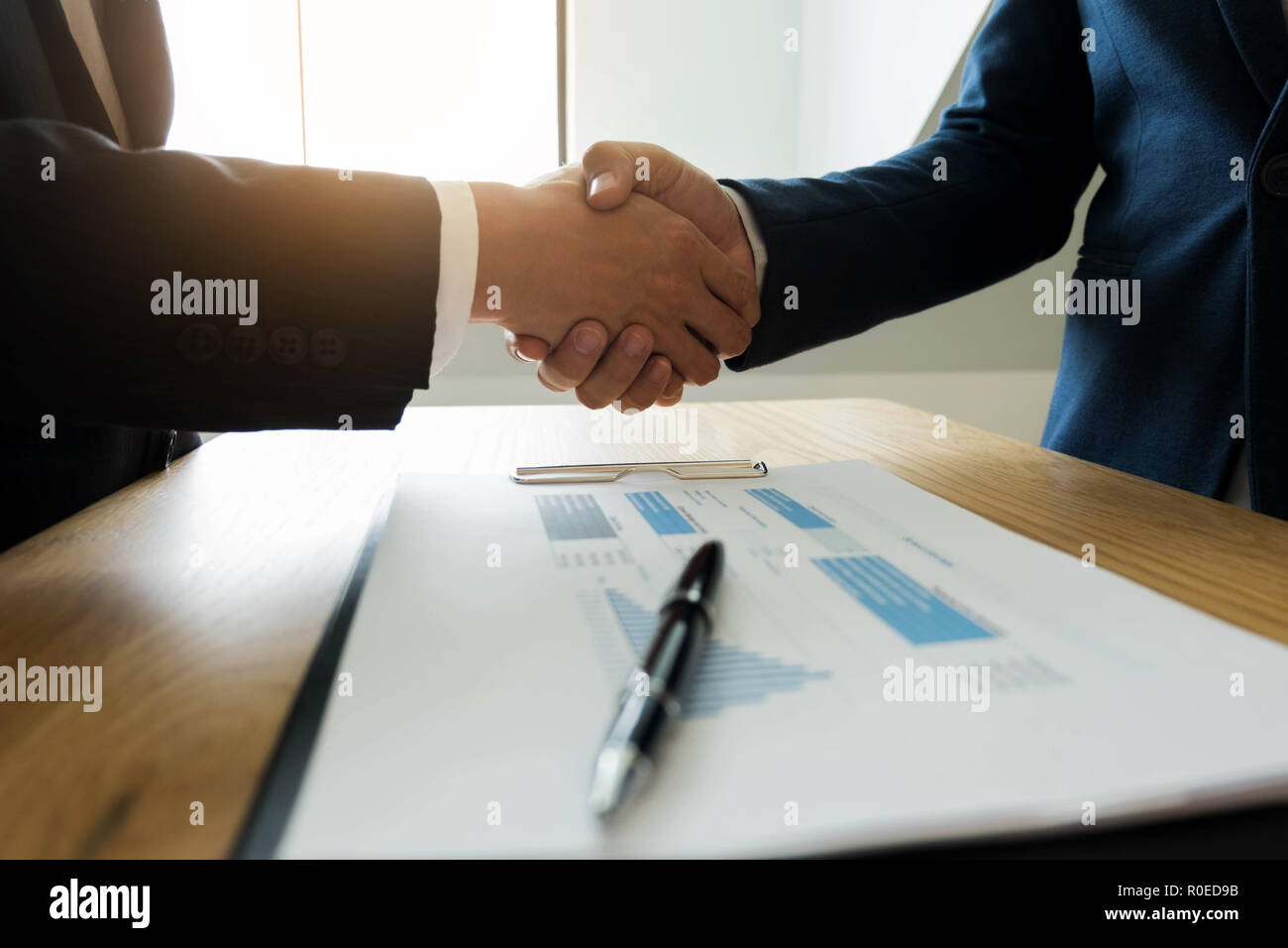 Business handshake. Business people shaking hands, finishing up a ...