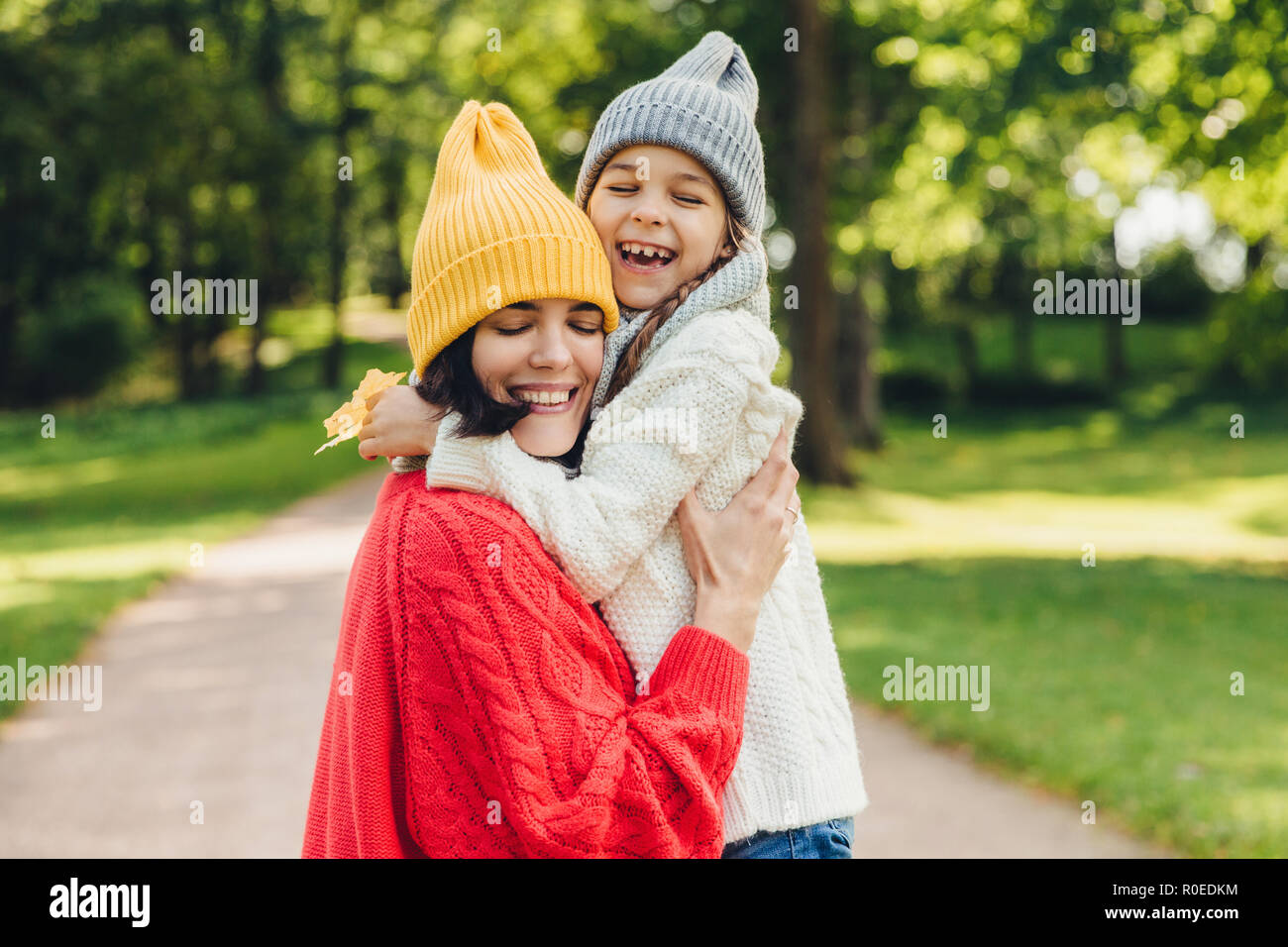 Parenthood, happiness and lifestyle concept. Beautiful female and her ...