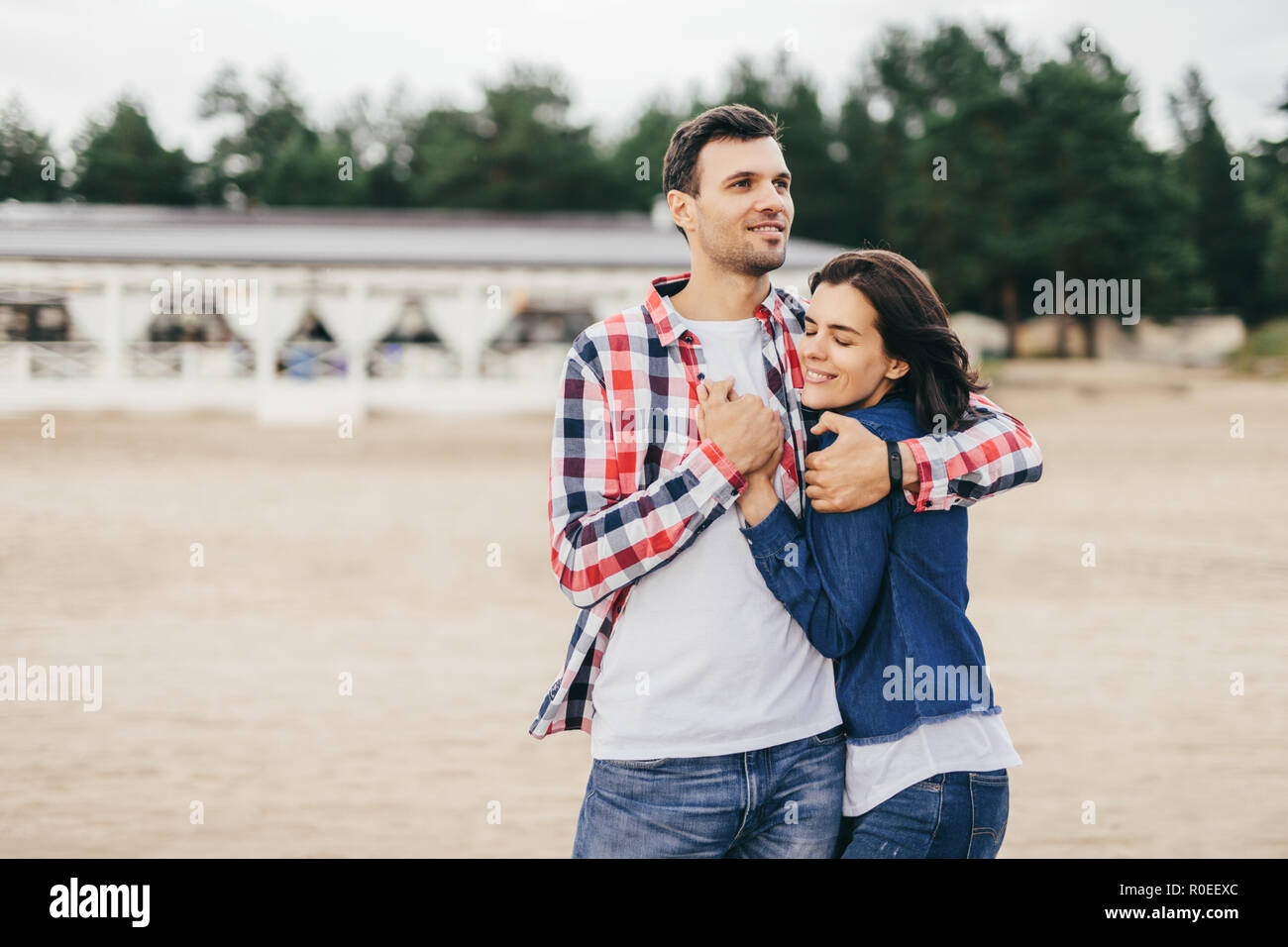 Affectionate couple in love embrace each other passionately, express ...