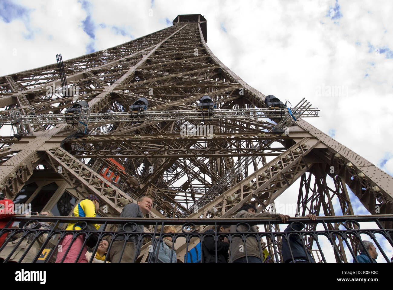 Tourists wait for the elevator to the top of the Eiffel Tower (La Tour ...