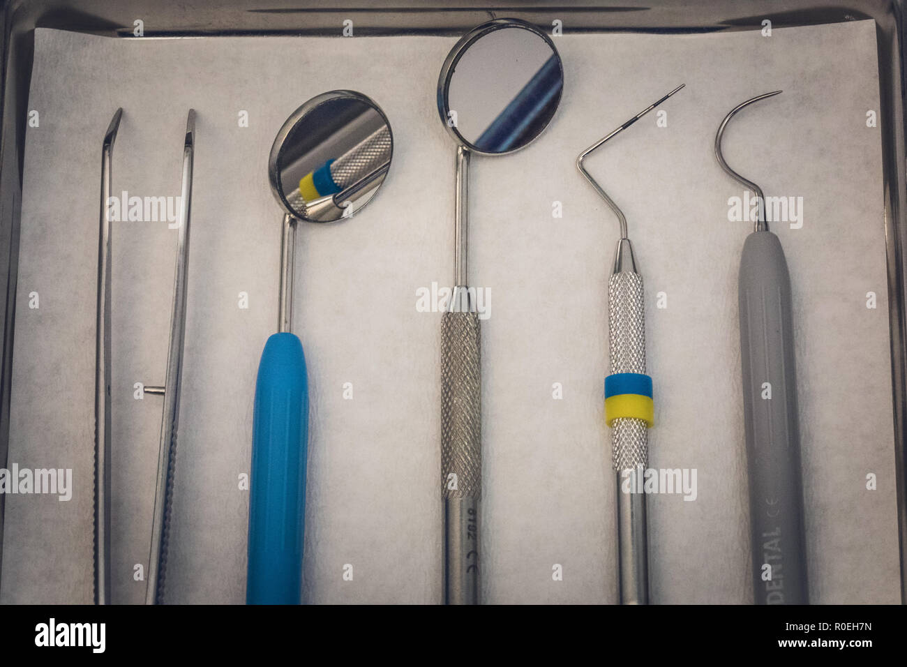 Detailed close up of different dental instruments and tools on a table ...