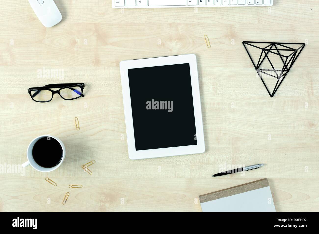 Feminine workspace with tablet with blank screen and accessories top ...