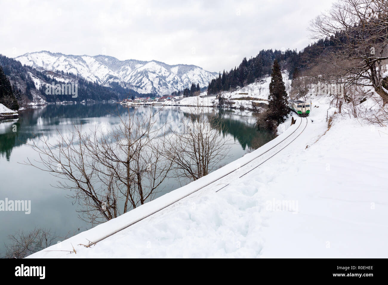 Train in Winter landscape snow on bridge Stock Photo - Alamy