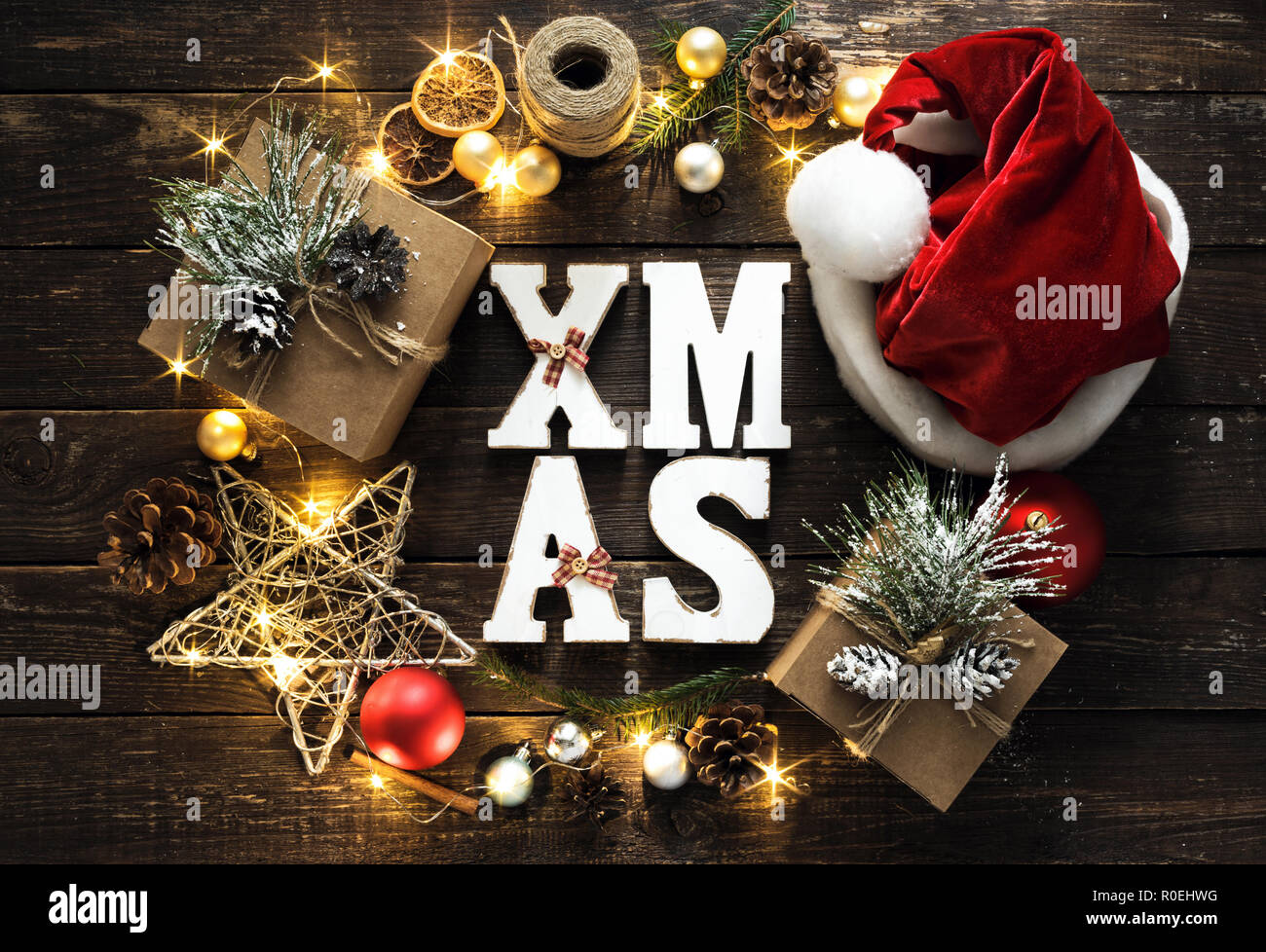 Christmas background. Word Xmas and wreath made of Christmas decoration ...