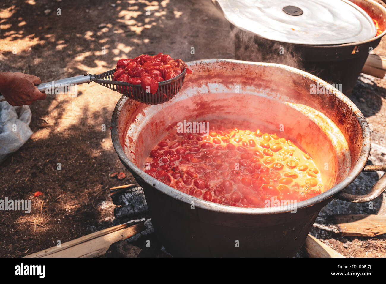 The traditional preparation of the tomato sauce in the south of italy ...