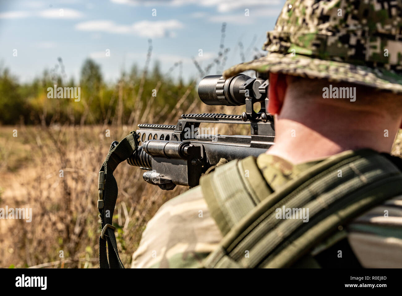 special forces, soldier assault rifle with silencer, optical sight ...