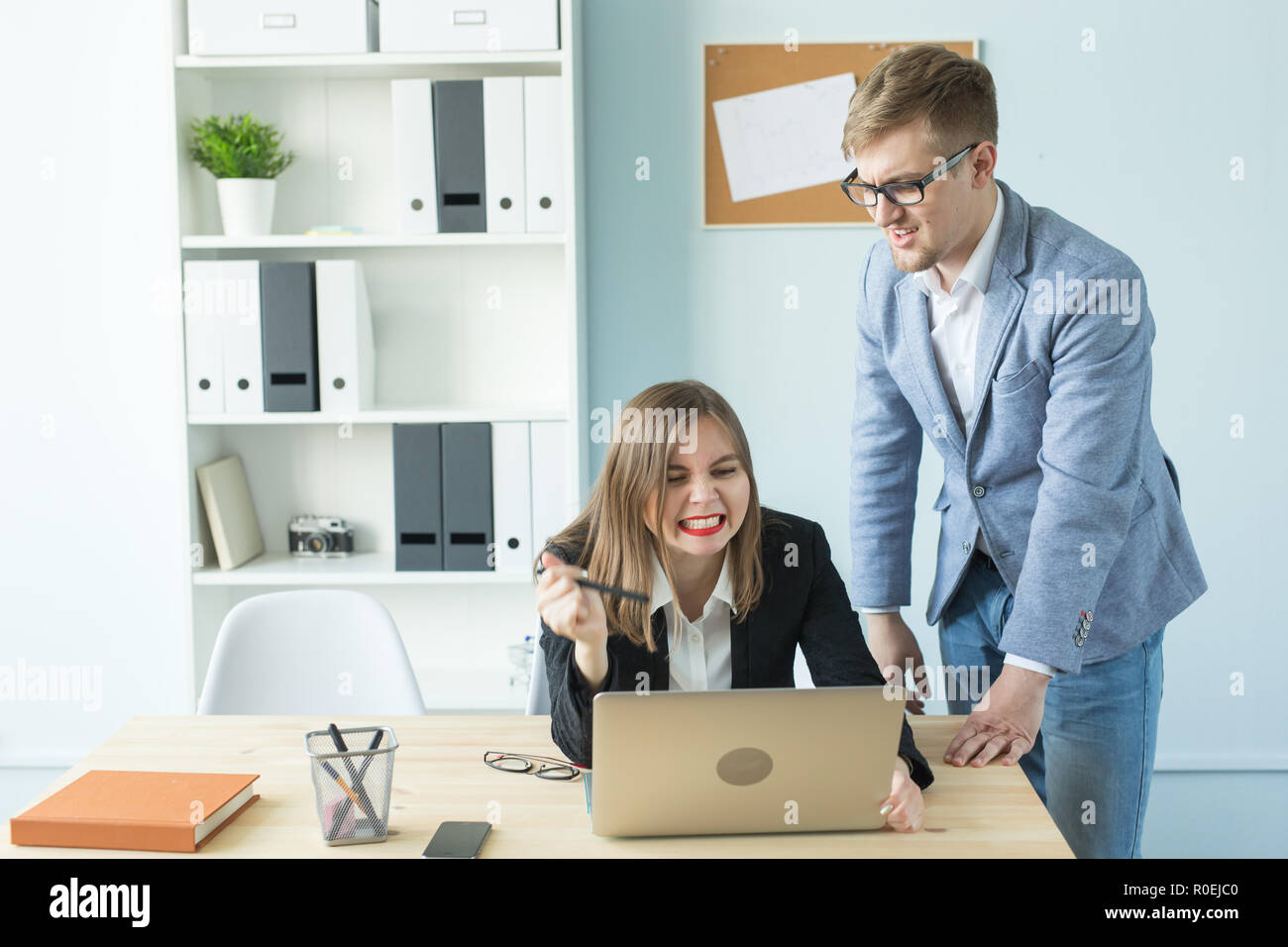 Business, stress and people concept - woman and man are working ...