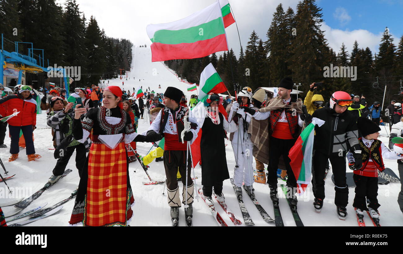 Skiing with Bulgarian flags at Pamporovo ski resort, Bulgaria. People ...