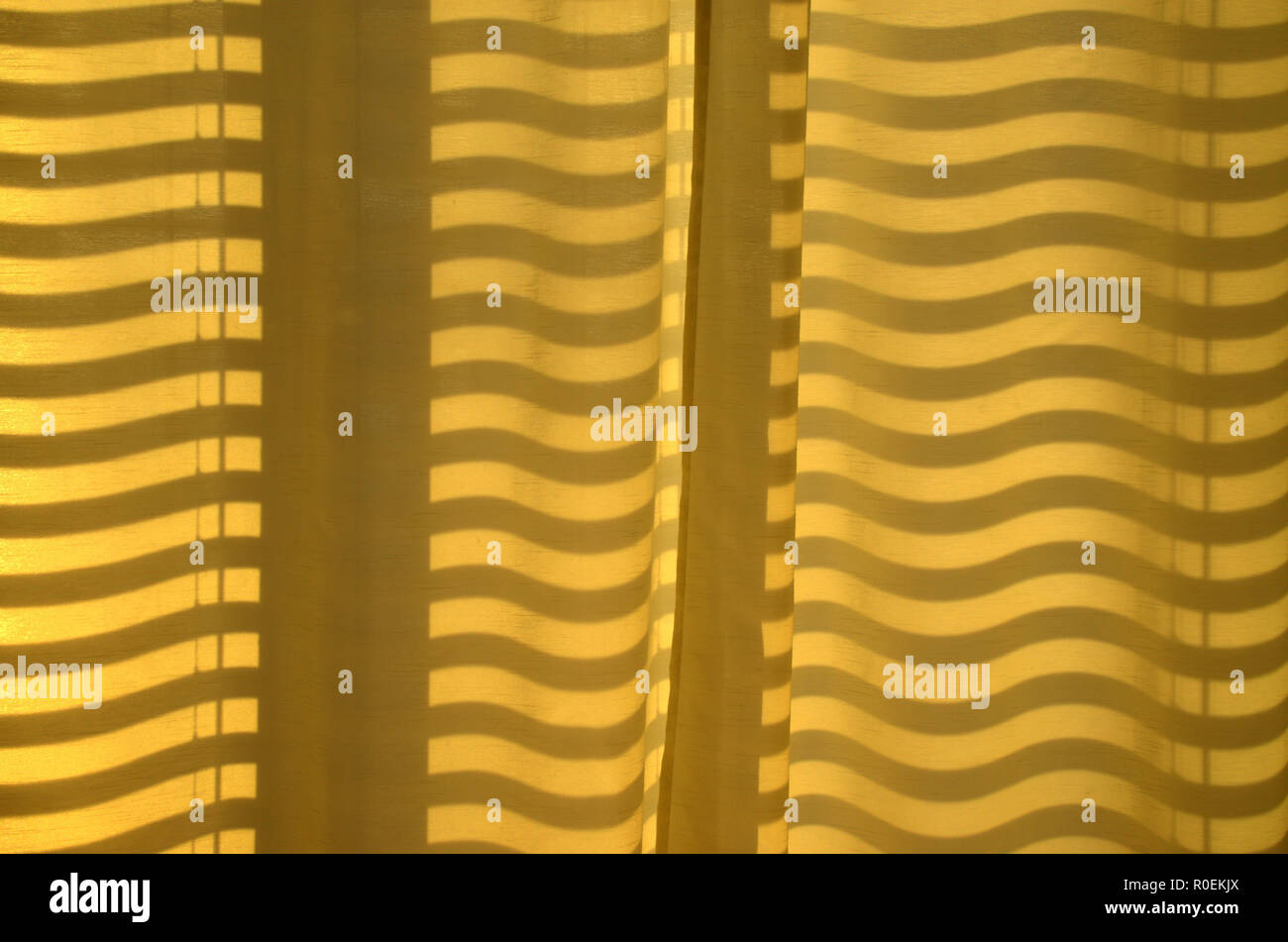Curved and straight shadow lines on a curtain Stock Photo - Alamy