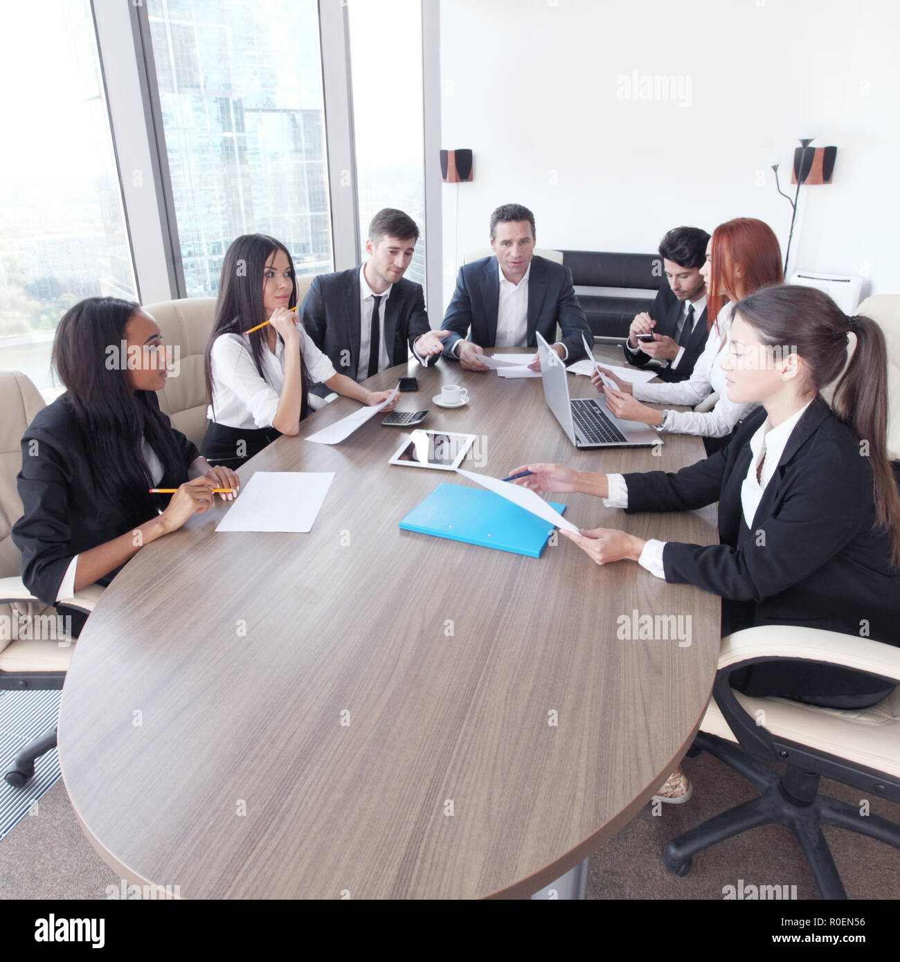 Business meeting of diverse people around the table Stock Photo - Alamy