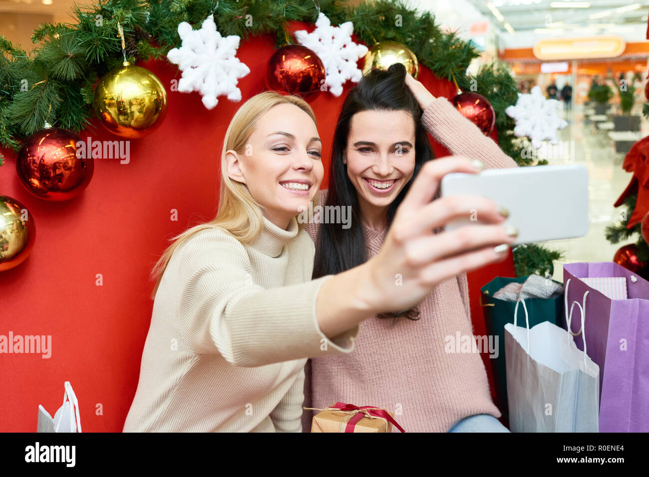 Girls having fun during shopping Stock Photo - Alamy