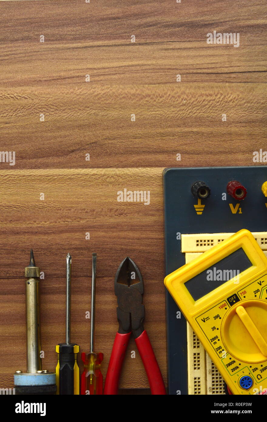 Electronic tools on wooden desk Stock Photo - Alamy