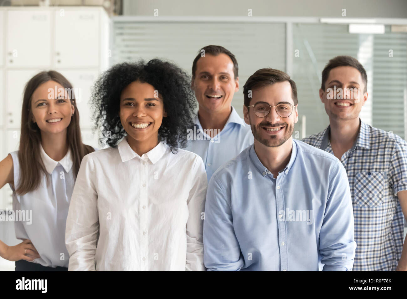 Happy multiracial professional employees looking at camera, team Stock ...
