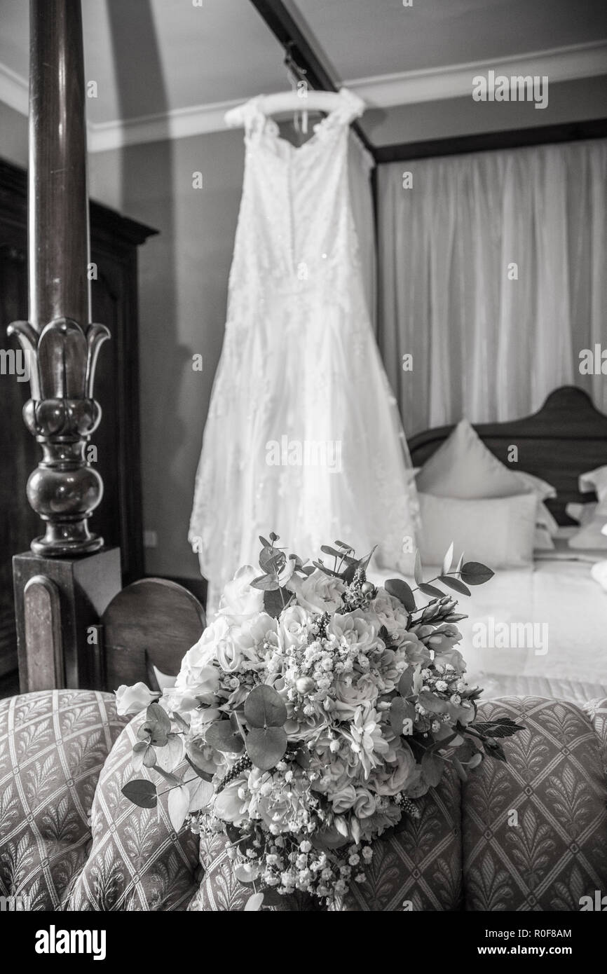 Wedding Dress hanging up waiting to be worn on a Brides wedding day ...