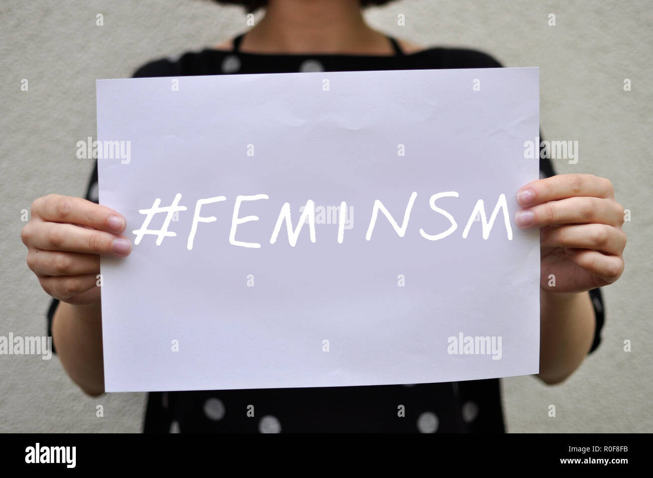 Hashtag Feminism Statement on a white sign Stock Photo - Alamy
