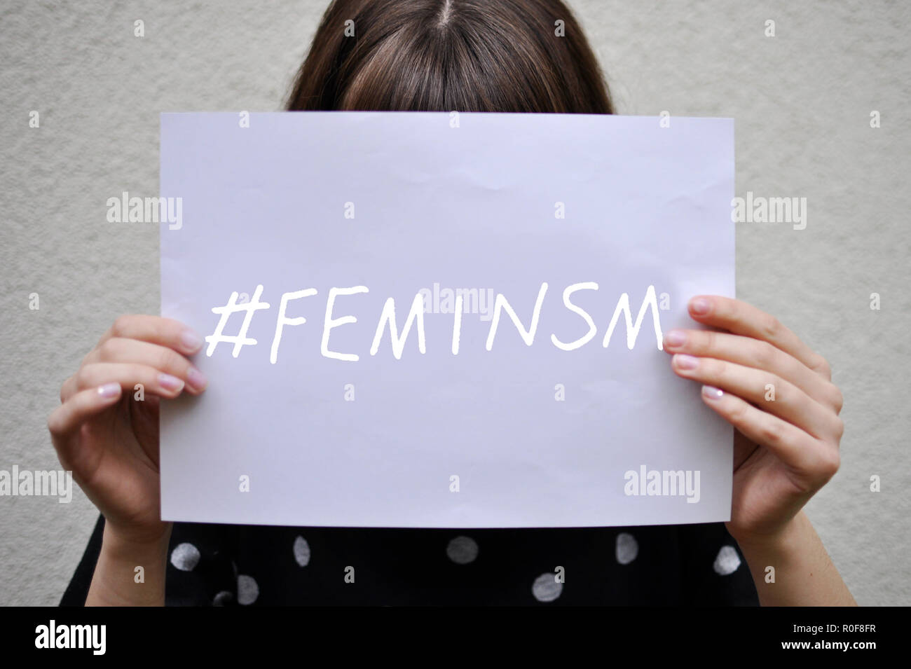Hashtag Feminism Statement on a white sign Stock Photo - Alamy