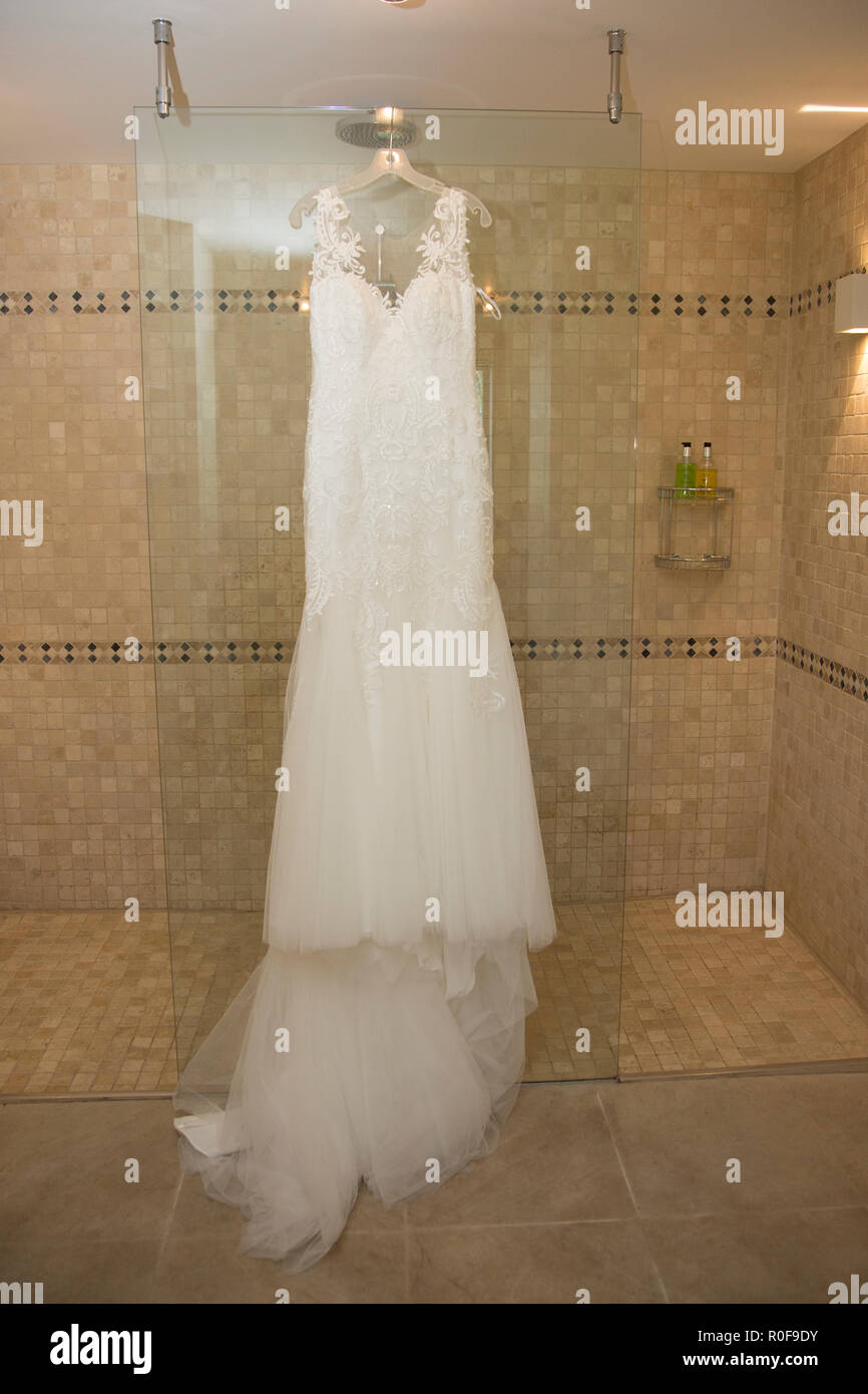 Wedding Dress hanging up waiting to be worn on a Brides wedding day ...