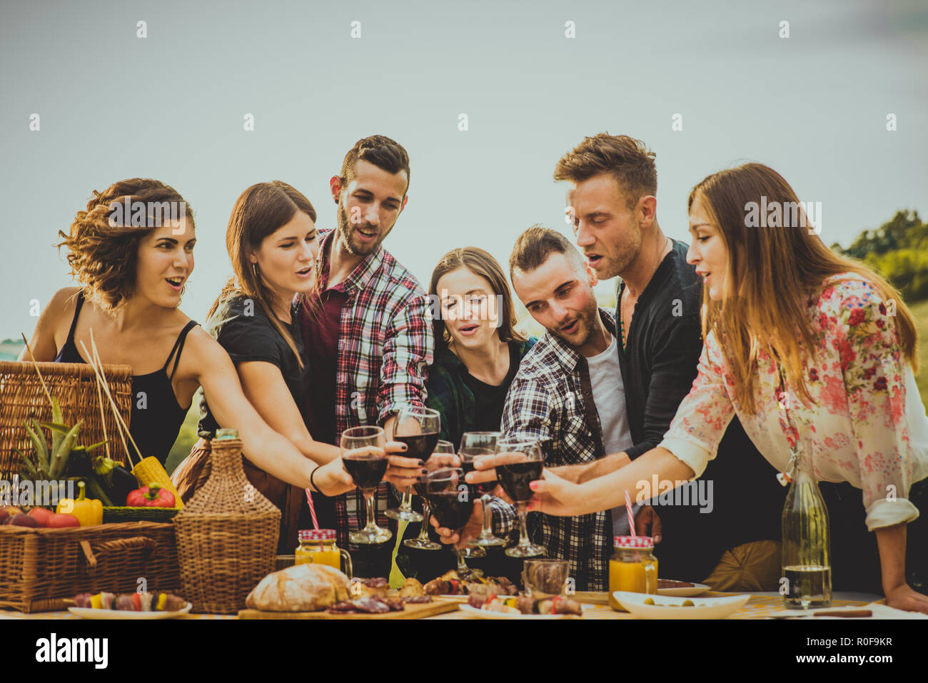 Group of young happy friends having pic-nic outdoors - People having ...