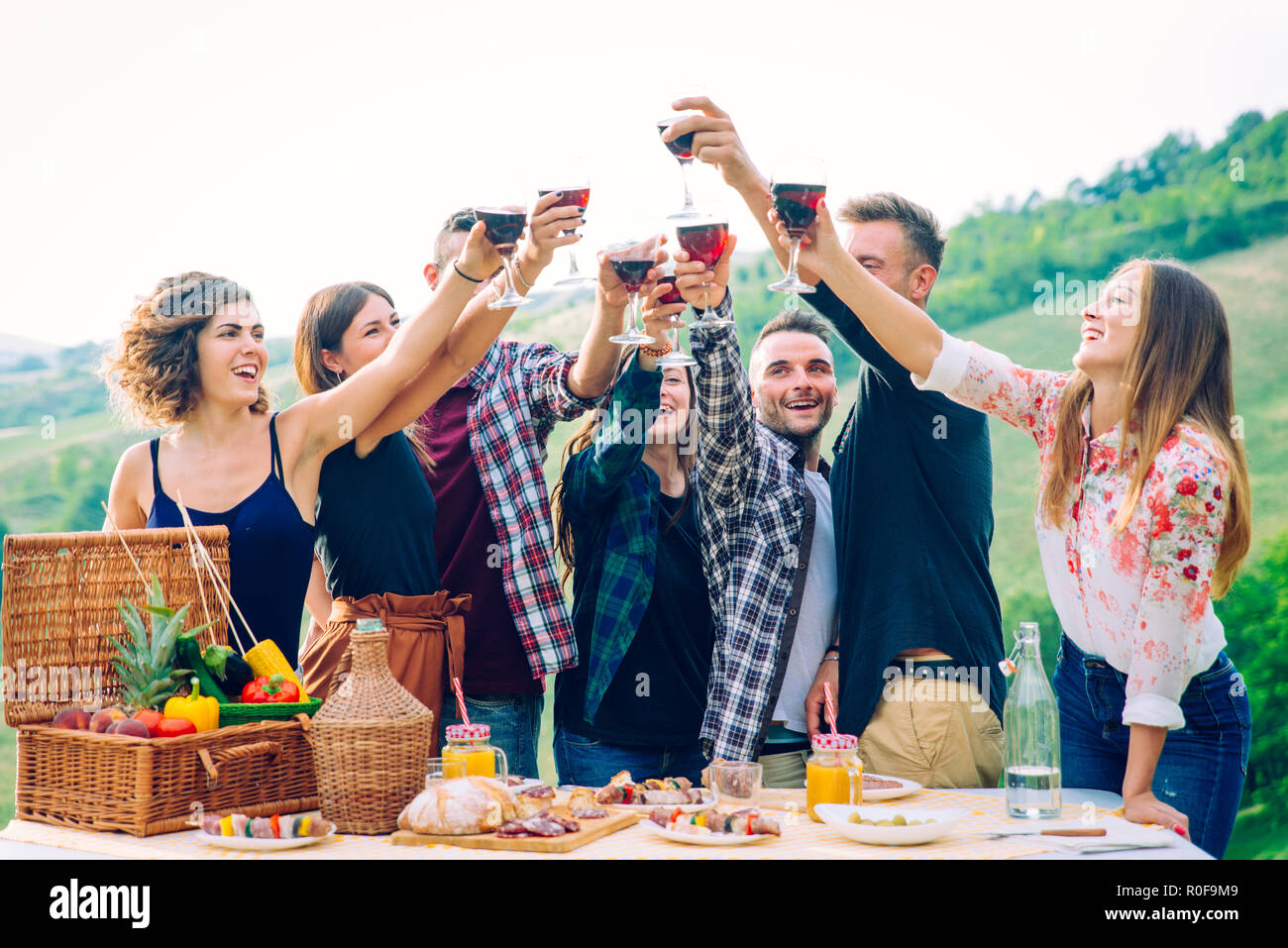 Group of young happy friends having pic-nic outdoors - People having ...