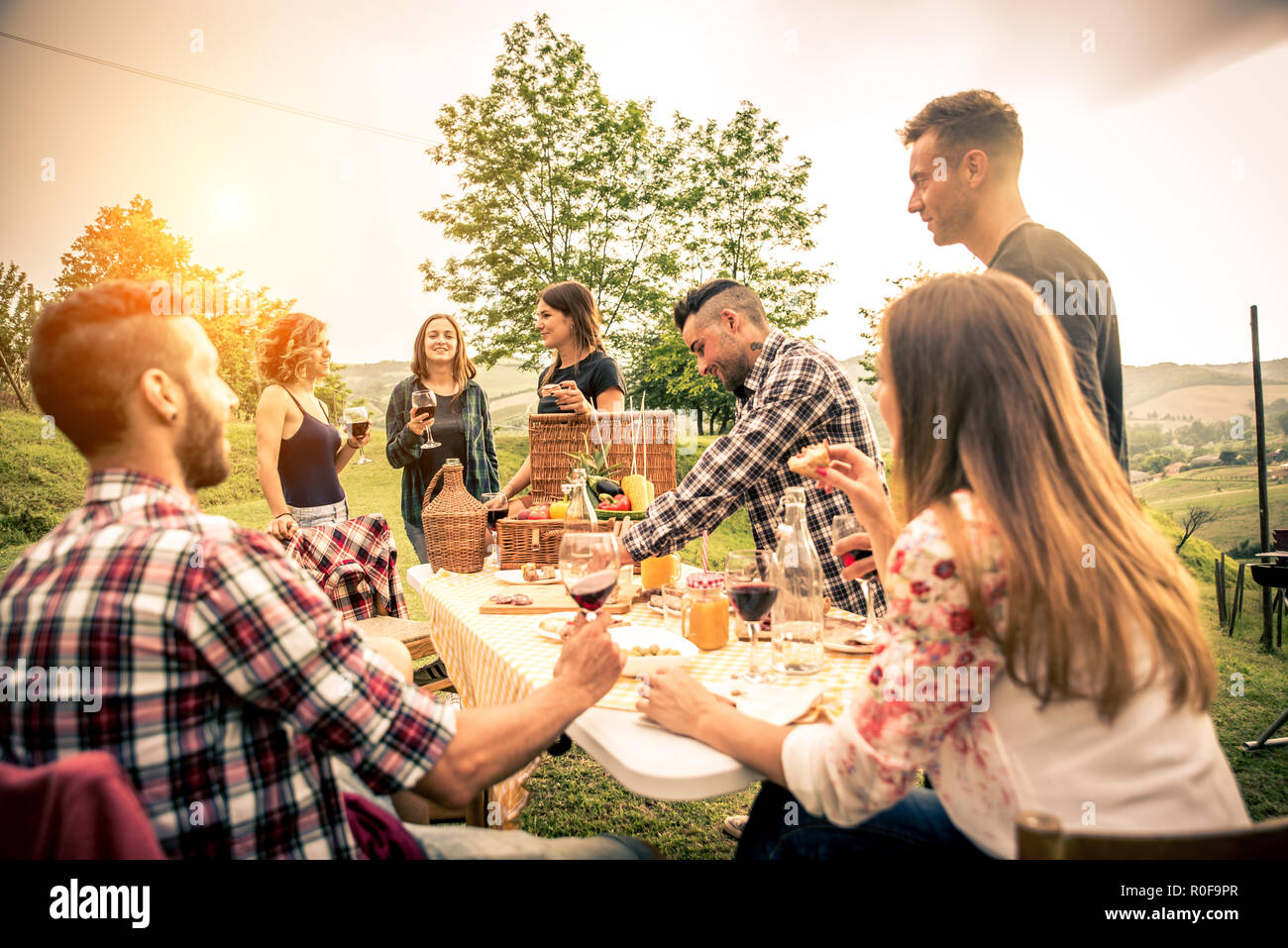 Group of young happy friends having pic-nic outdoors - People having ...