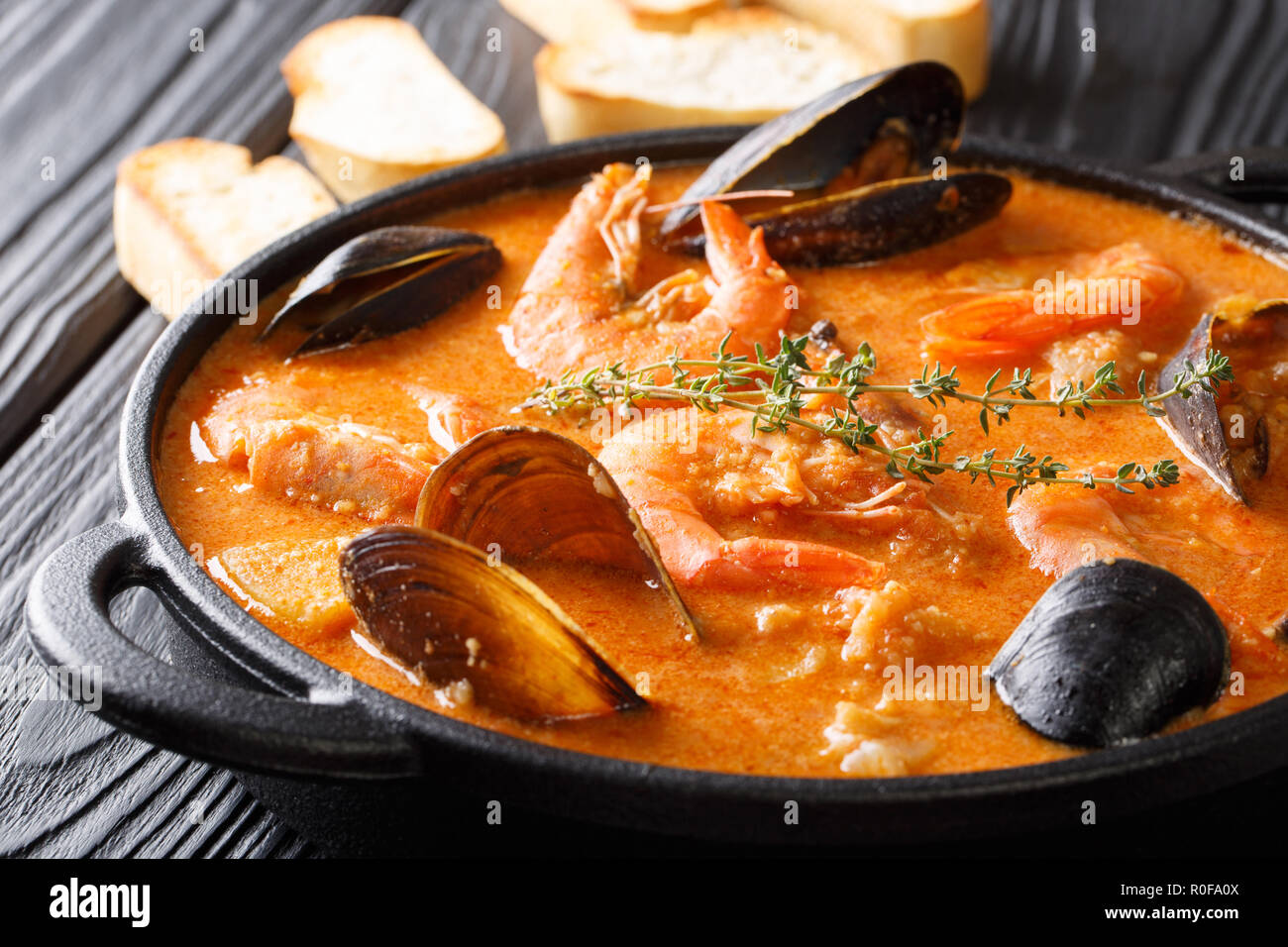 The rich taste of seafood Suquet de Peix soup with potatoes, herbs and ...