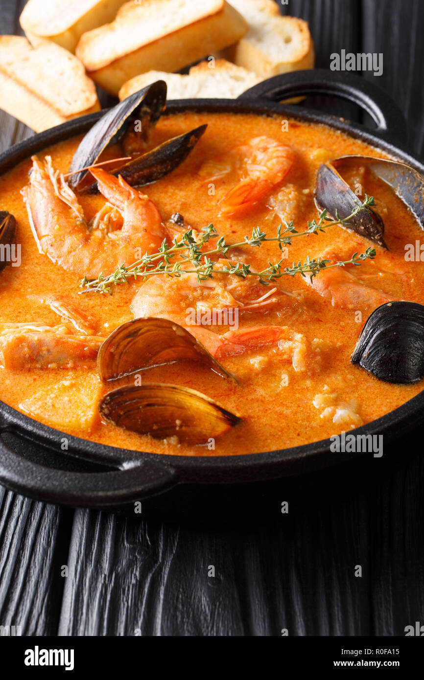 Seafood Suquet de Peix soup with potatoes, herbs and fish with the ...