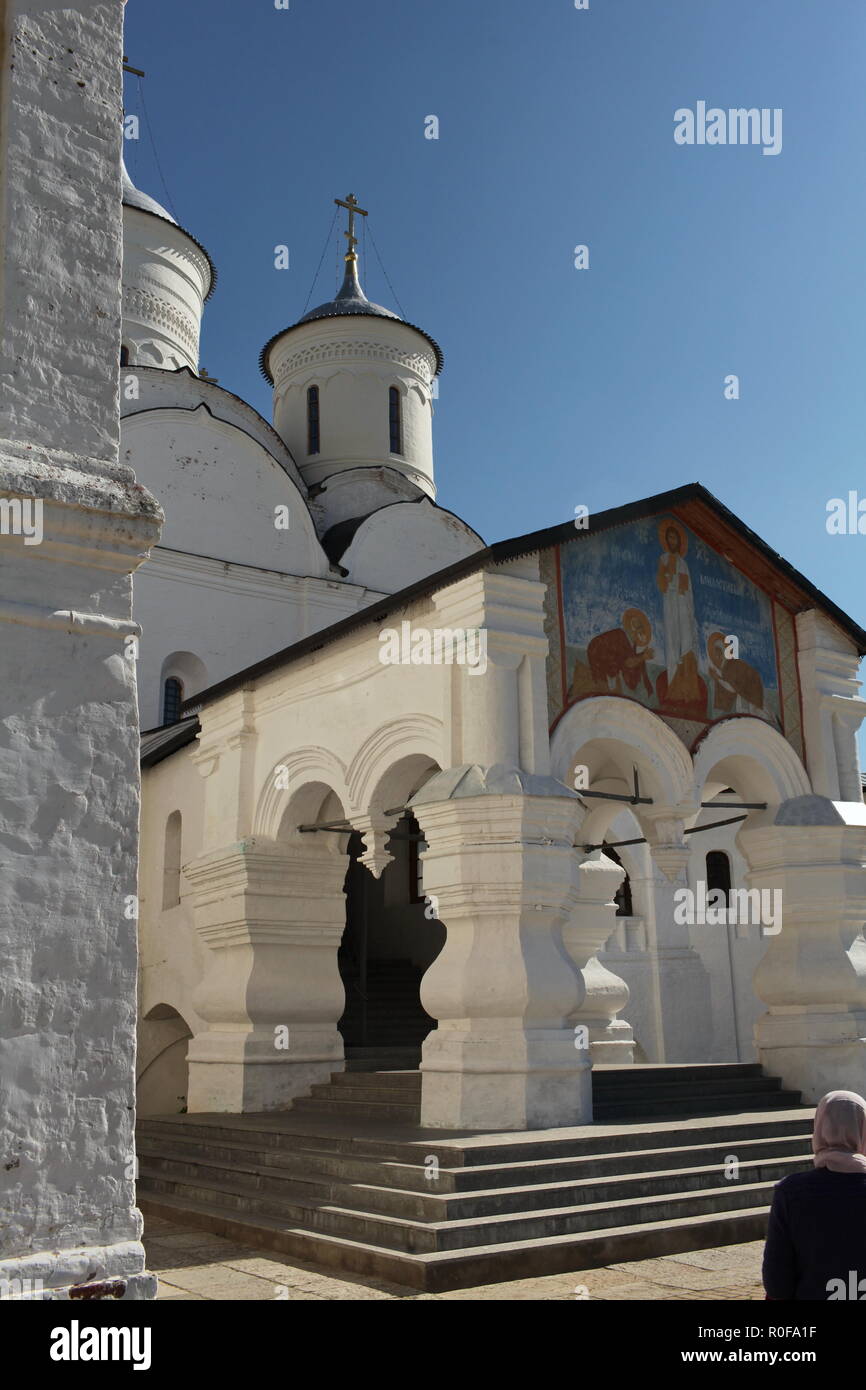 pilgrim at the entrance to a Christian temple, portico on huge columns ...