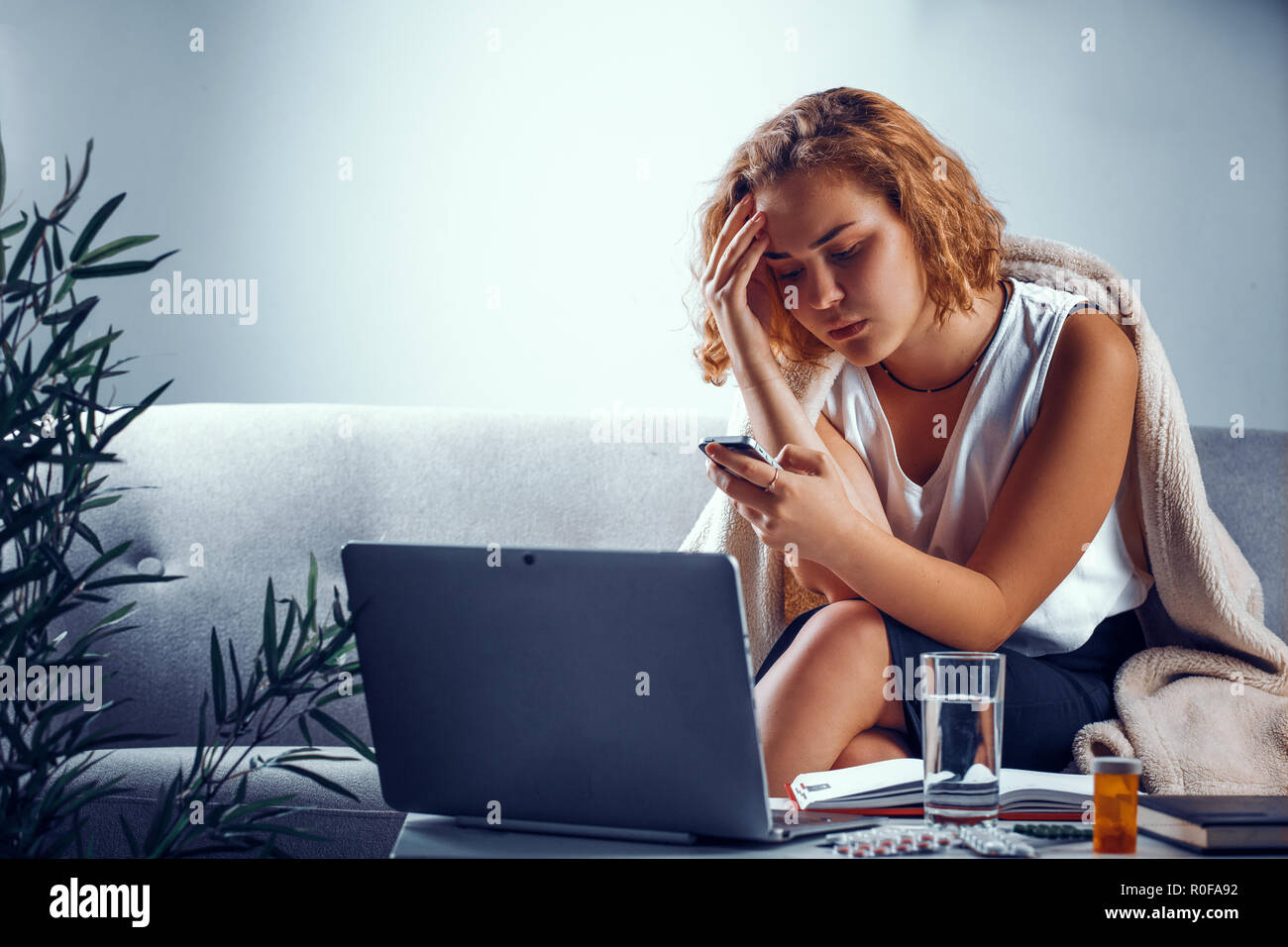 Sick girl is on the phone Stock Photo - Alamy