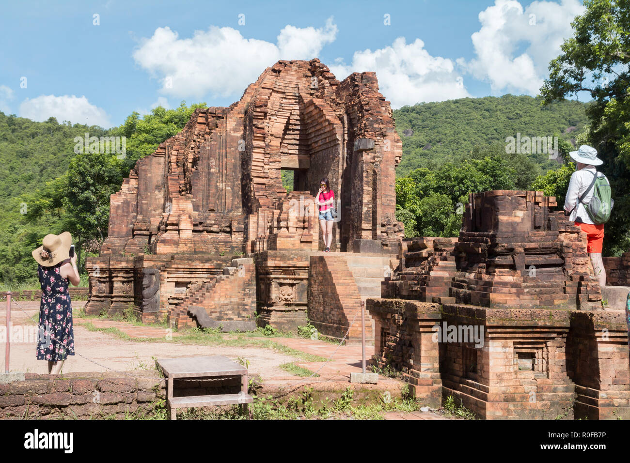 tourists exploring ancient town ruins in My Son, Vietnam Stock Photo ...