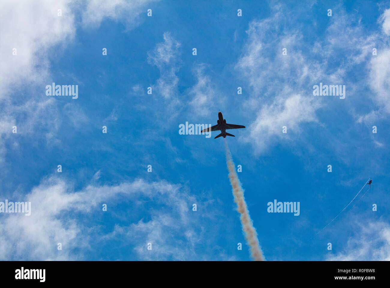 RAF Red Arrow Hawk displaying at Torbay Airshow Stock Photo - Alamy