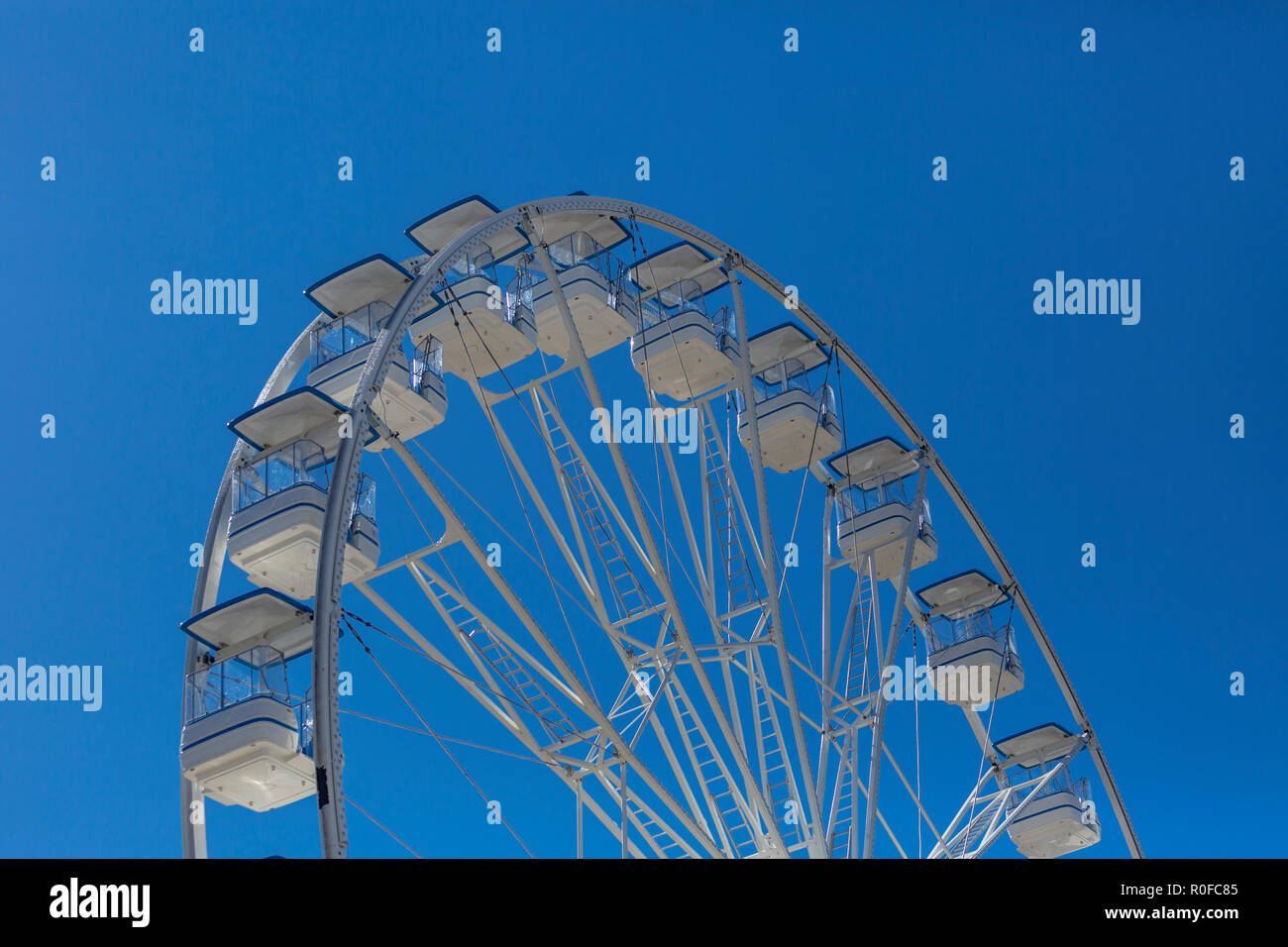 Giant ferris wheel with chairs, metallic structure, recreational ...