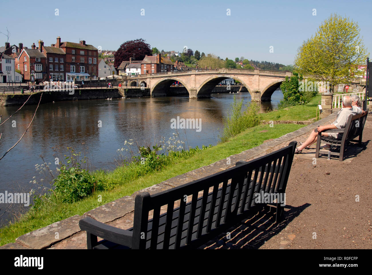 Couple Sitting On A Seat Beside The River Severn Bewdley
