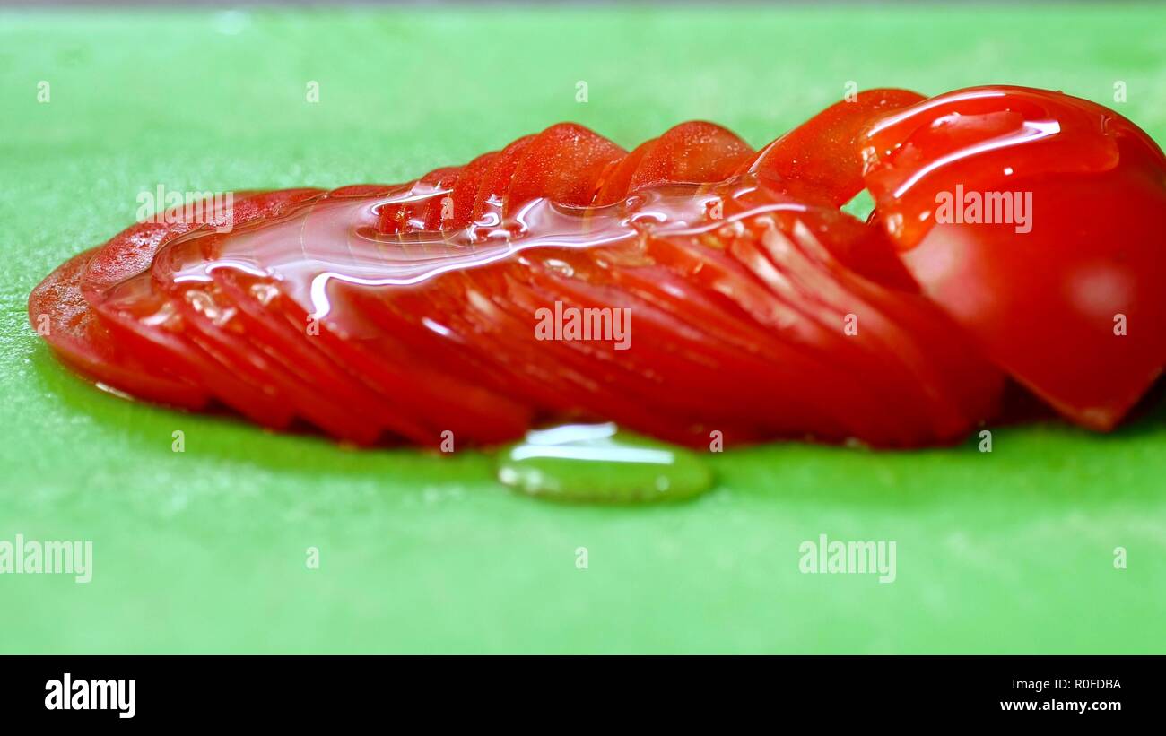 Olive Oil Over Tomato Slices Stock Photo - Alamy