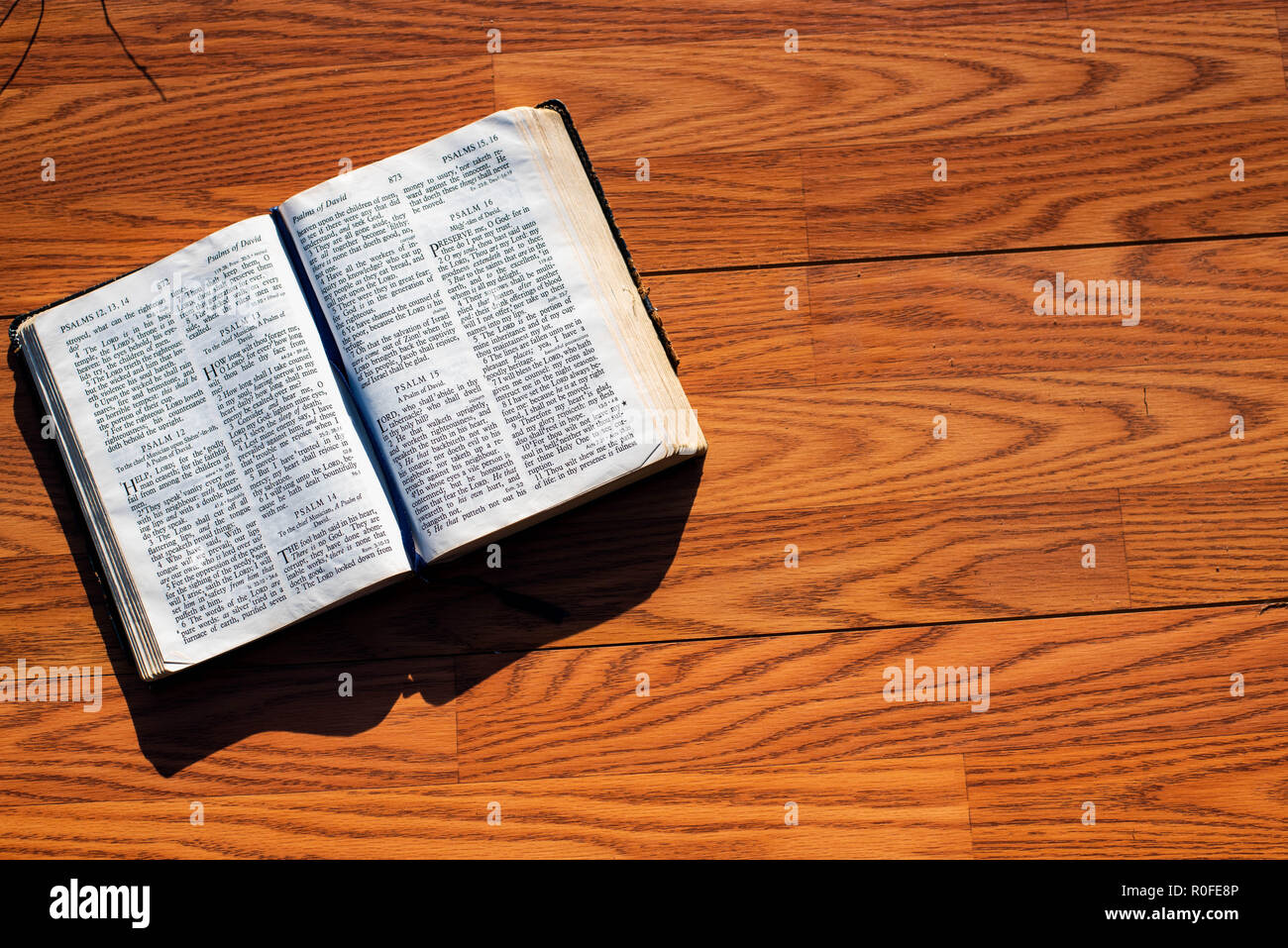 A bible lays open on a sidewalk Stock Photo - Alamy