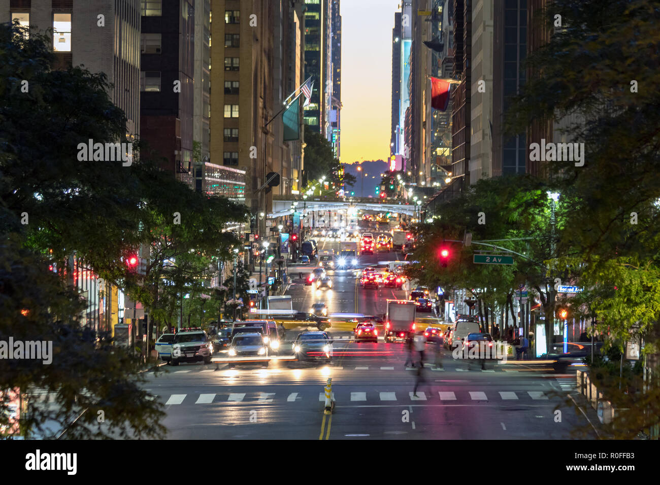 Colorful night lights of a busy scene on 42nd Street in Midtown ...