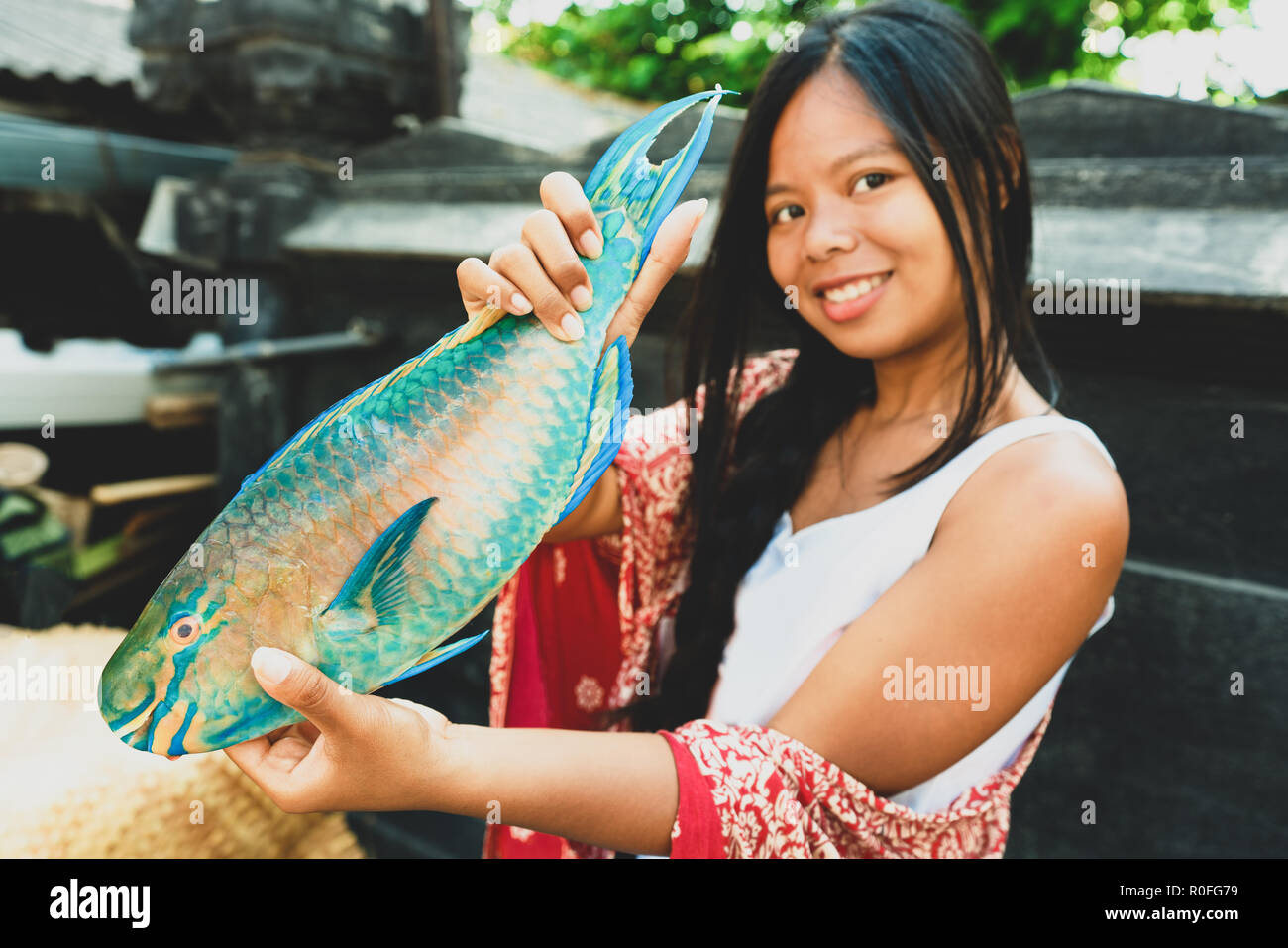 Young asian woman holding fishing hi-res stock photography and images ...
