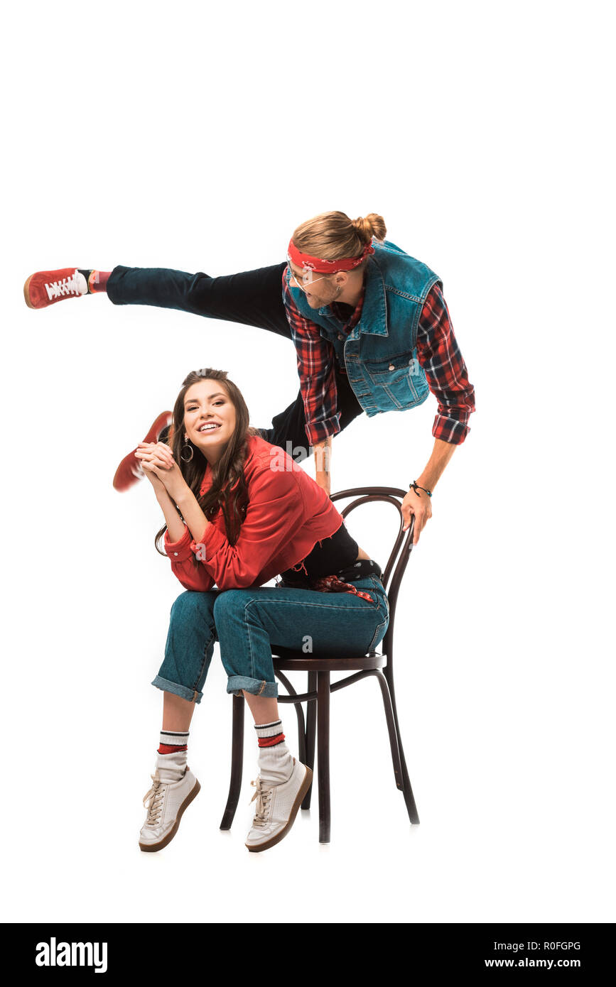 beautiful happy woman sitting on chair while her hipster boyfriend ...