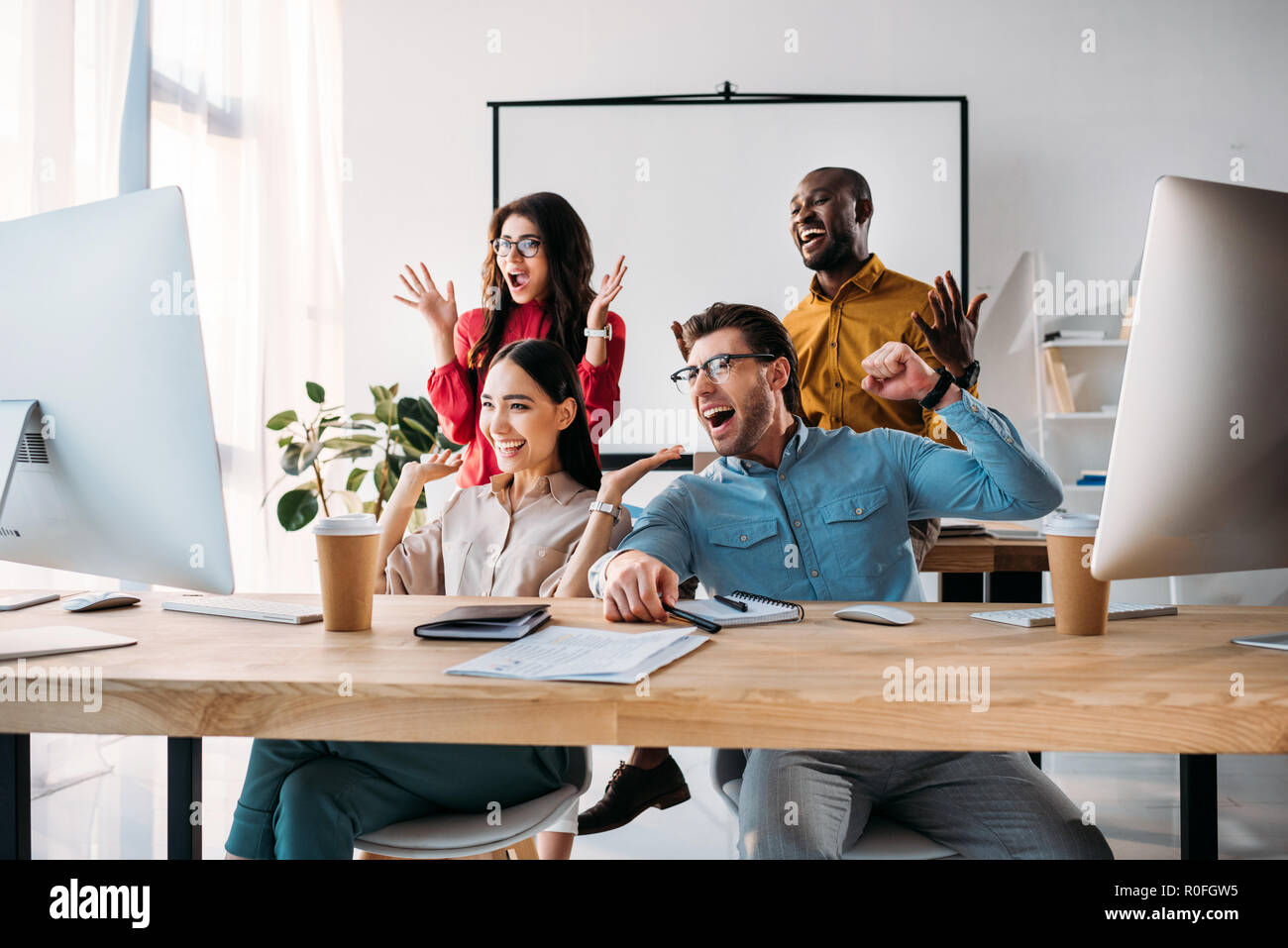 Happy multiracial business team hi-res stock photography and images - Alamy