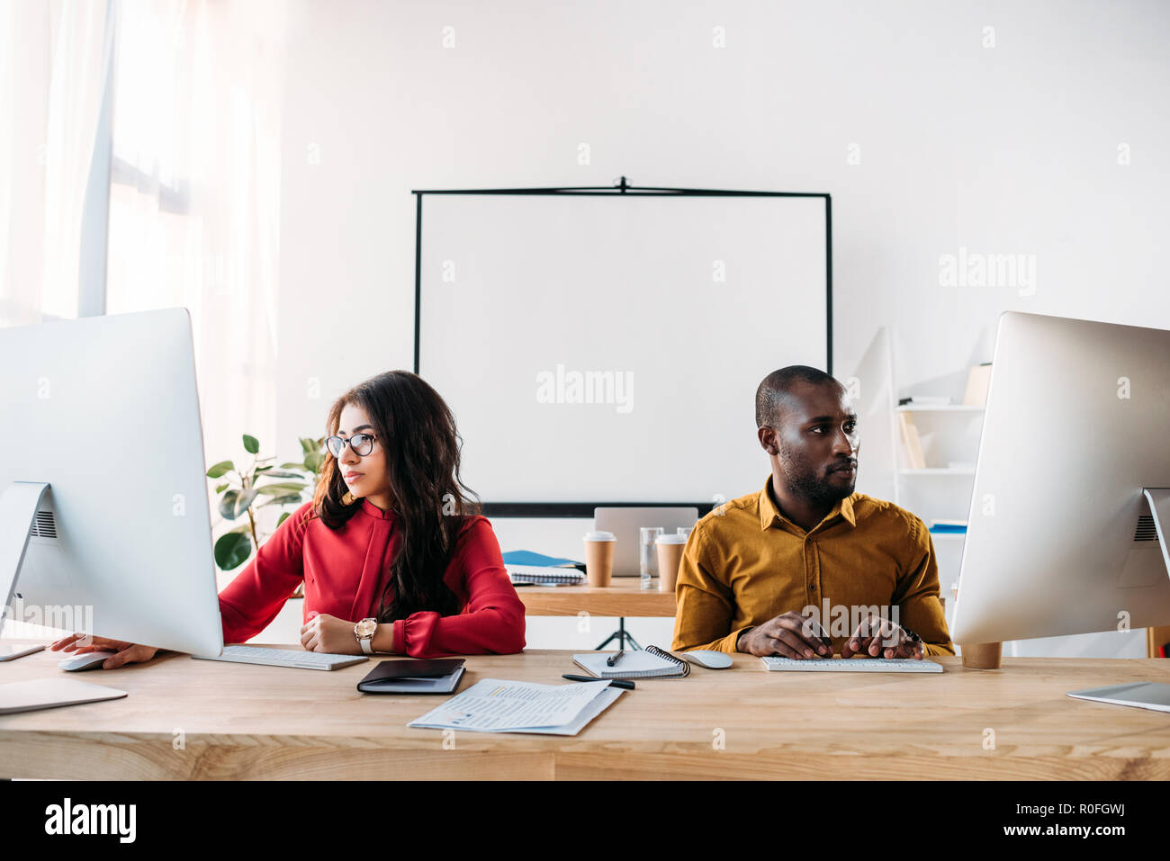 portrait of african american business people at workplace in office ...