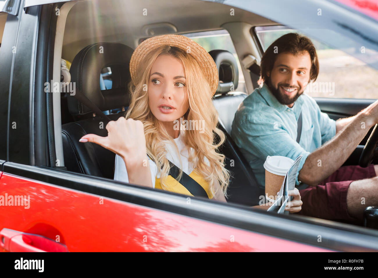 girlfriend holding map and showing way to boyfriend while traveling by ...