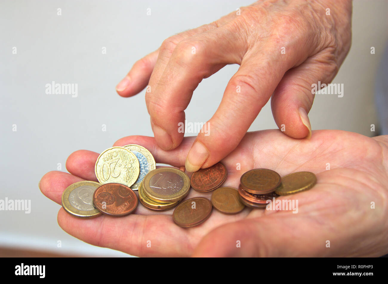 Beggar counting coins hi-res stock photography and images - Alamy