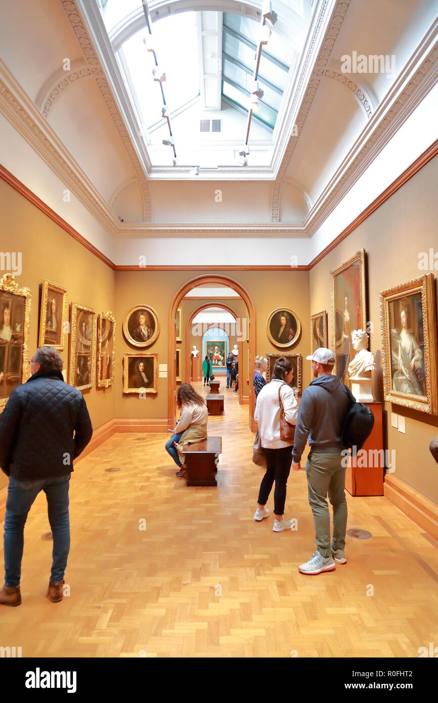 Visitors admiring the art at the National Portrait Gallery, London, UK ...