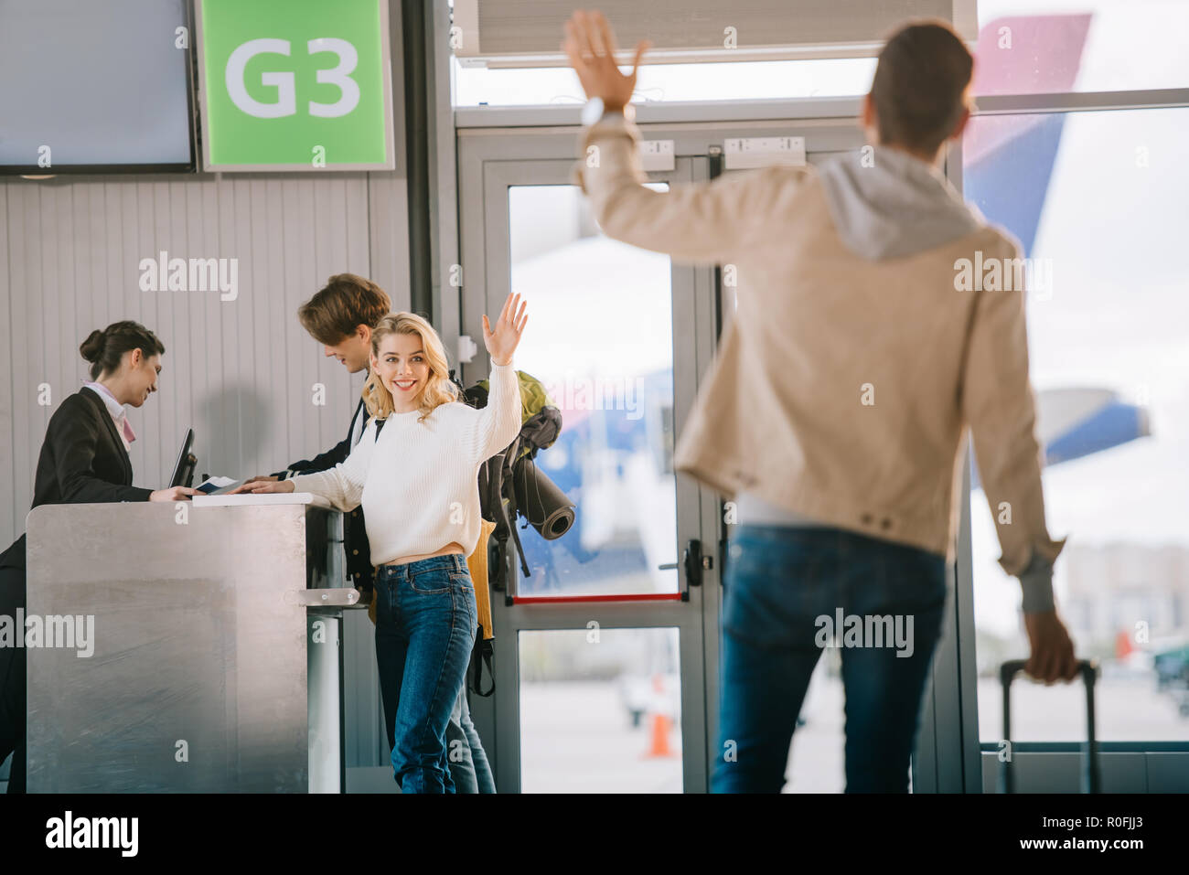 Happy female check in flight hi-res stock photography and images - Alamy