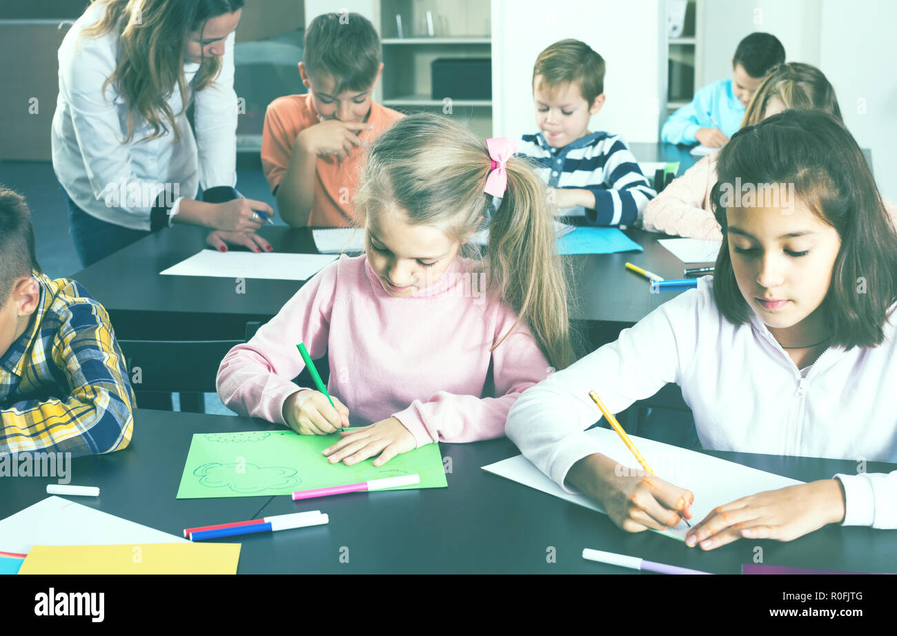happy american children of elementary age having class of art Stock ...