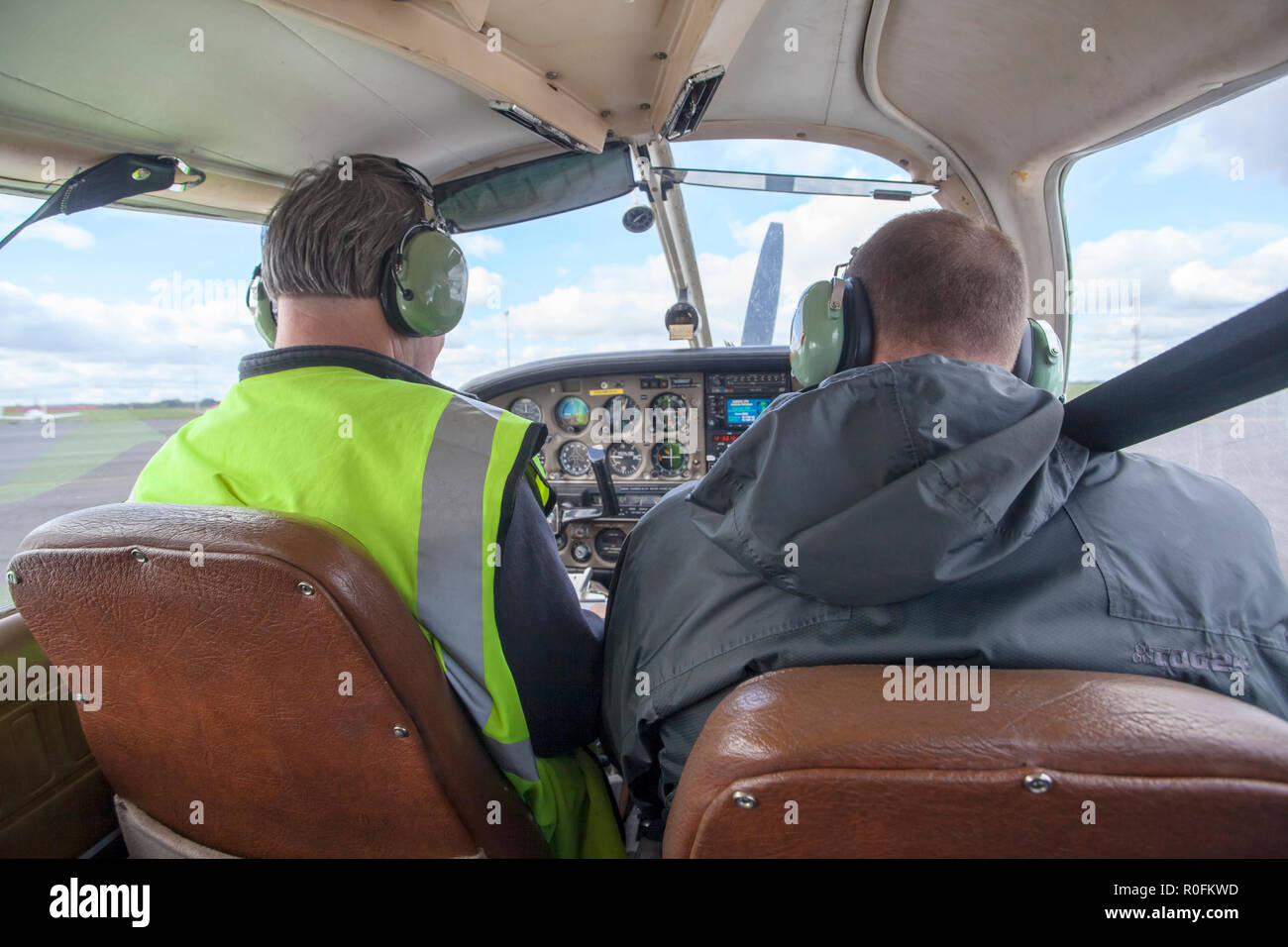 Pilot and co pilot flying in a Piper PA-28 Cherokee light aircraft out ...