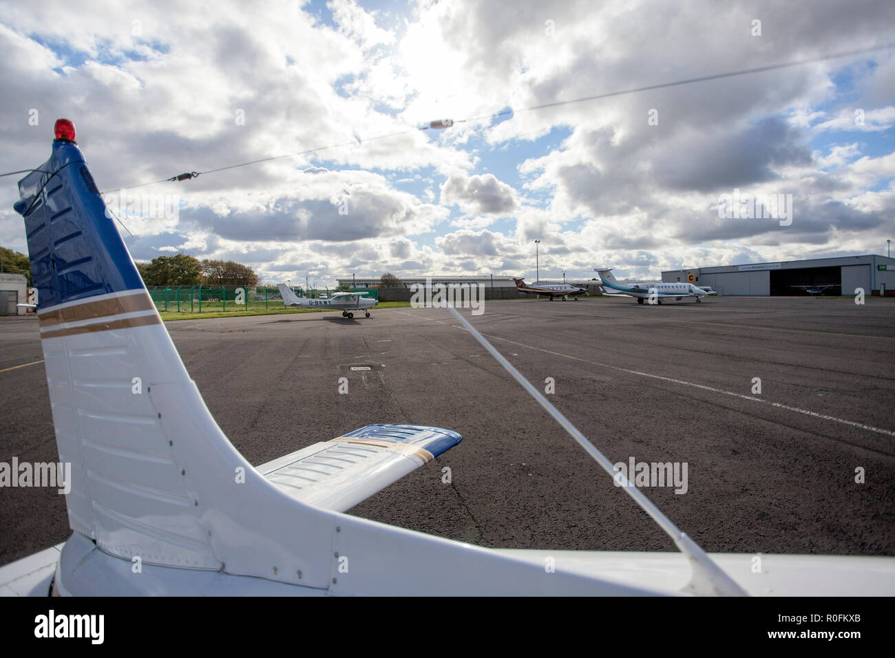 The tail of a Piper PA-28 Cherokee light aircraft, other planes in the ...